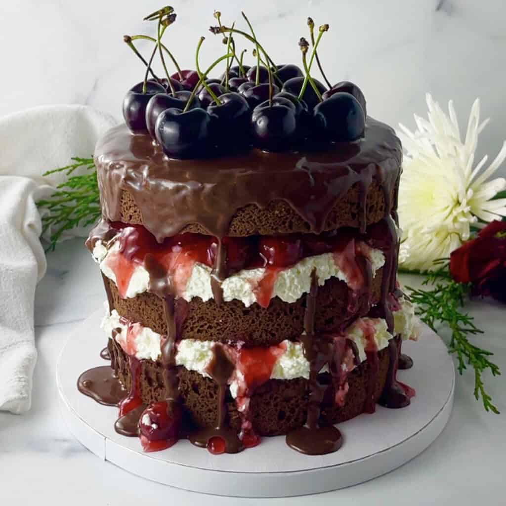 Easy Black Forest Cake Recipe with Chocolate Ganache - Mom Loves Baking