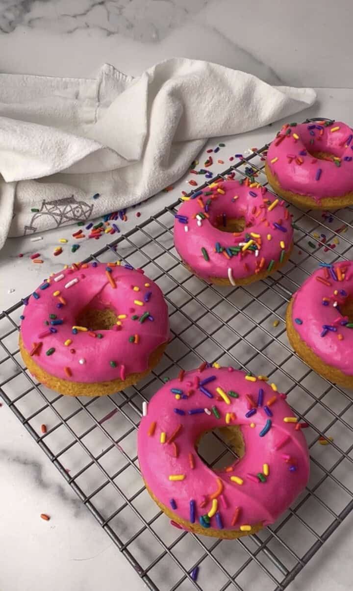 Pink Frosted Cake Mix Donuts Recipe in a Donut Pan - Mom Loves Baking
