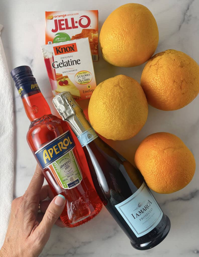 Aperol Spritz Jello Shot Recipe in Orange Peels - Mom Loves Baking