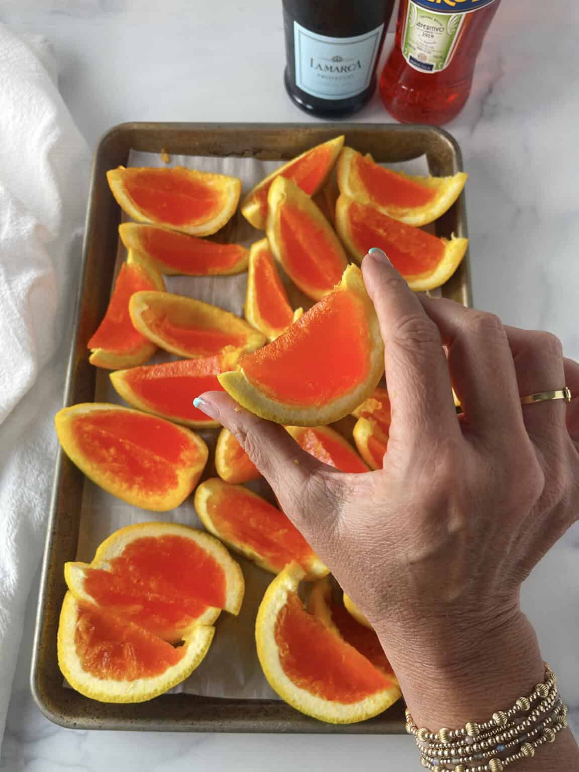 Aperol Spritz Jello Shot Recipe in Orange Peels - Mom Loves Baking