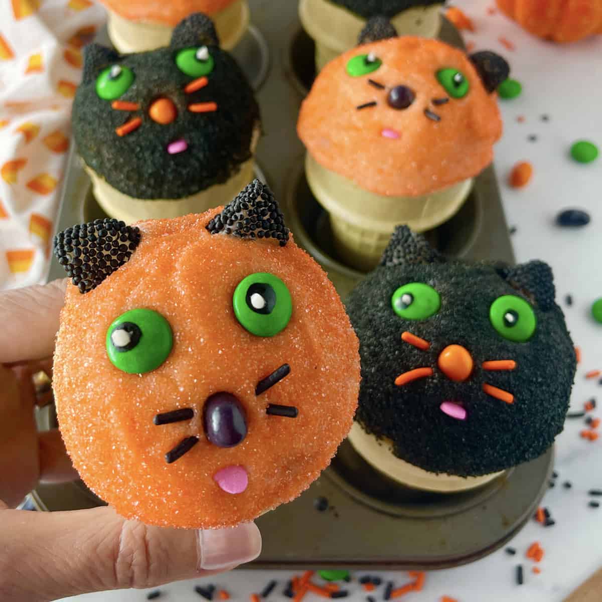 Black and Orange Kitty Cat Cupcakes in Ice Cream Cones - Mom Loves Baking